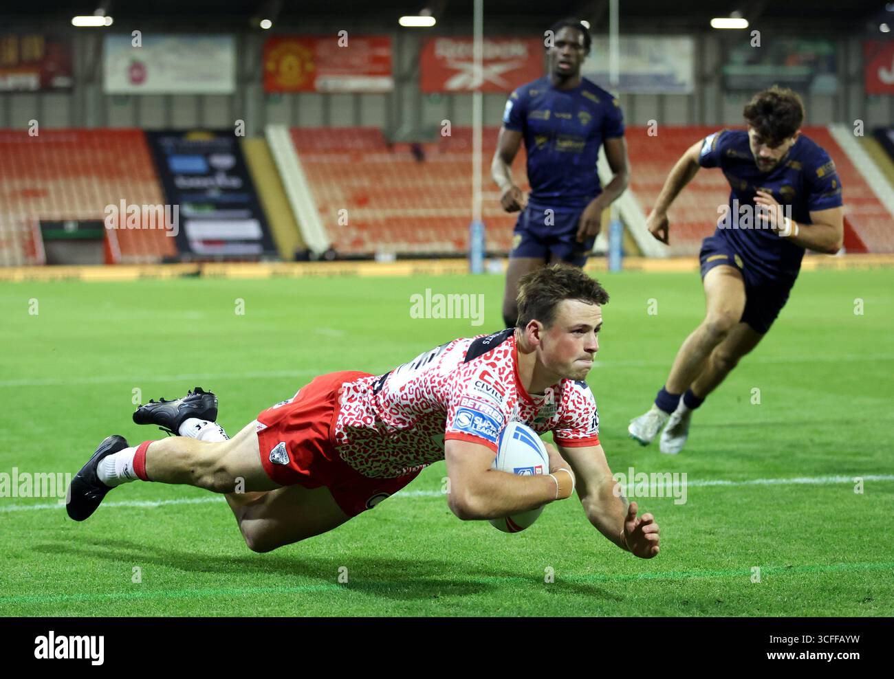 Leigh Leopards' AJ Towse scores their side's seventh try of the game ...