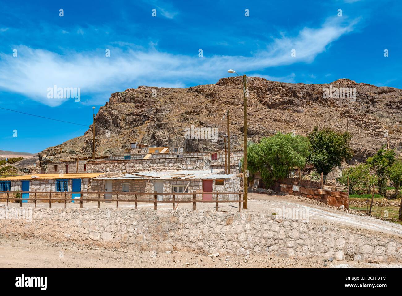 A close-up of a rustic, stone houses with straw roof in the village of ...