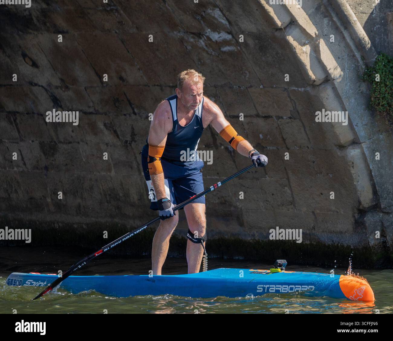 Action photography of Stand Up Paddleboarding (SUP) athletes competing ...