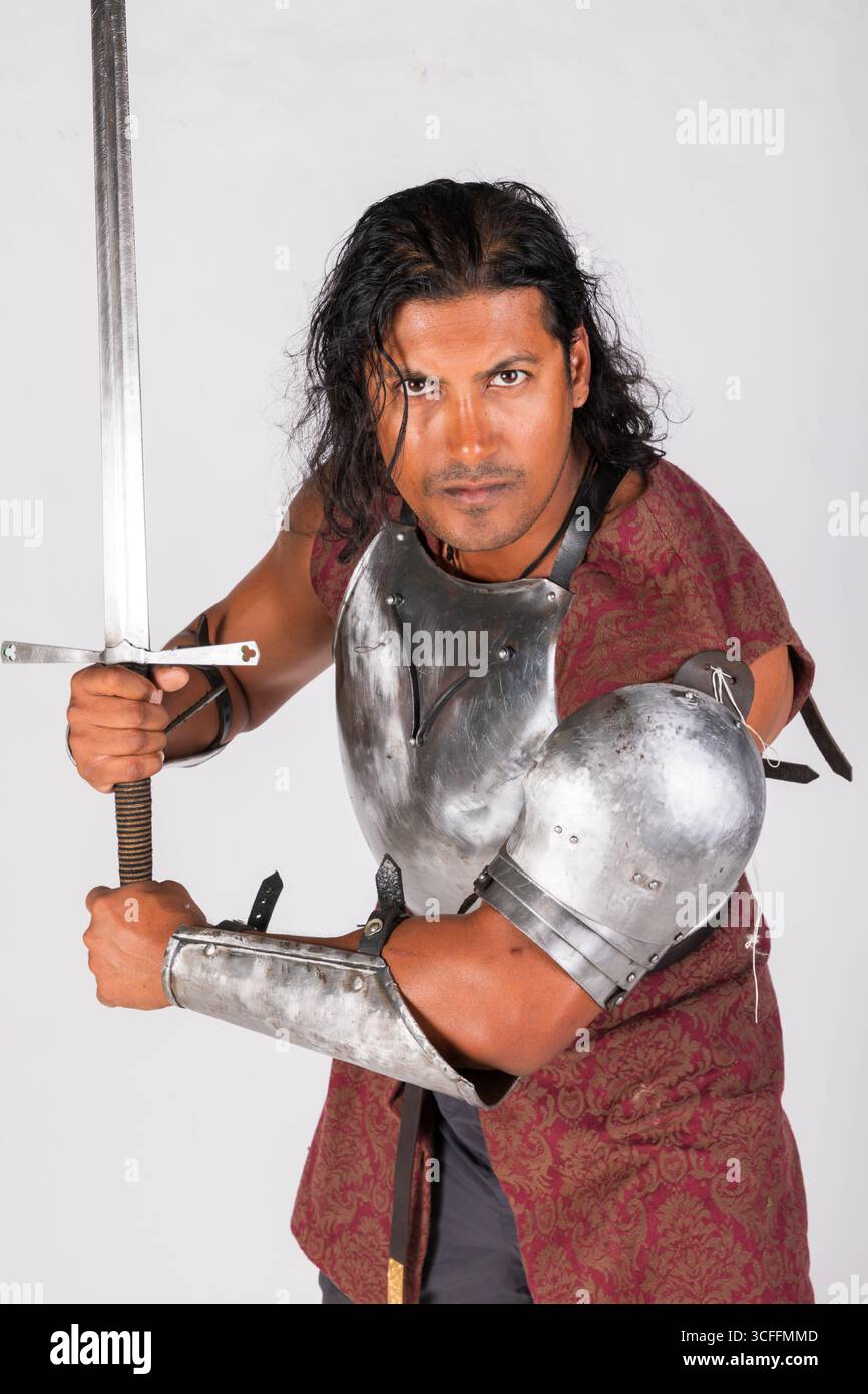 Medieval soldier with sword. Wearing armour for protection Stock Photo ...