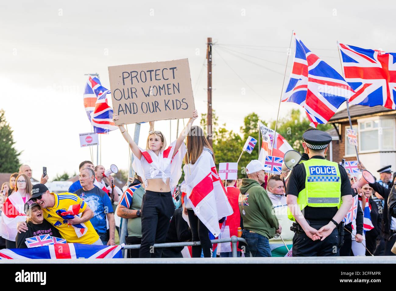 Leeds, UK. 22 AUG, 2025. Girl holds sign with "Protect Our Women and ...