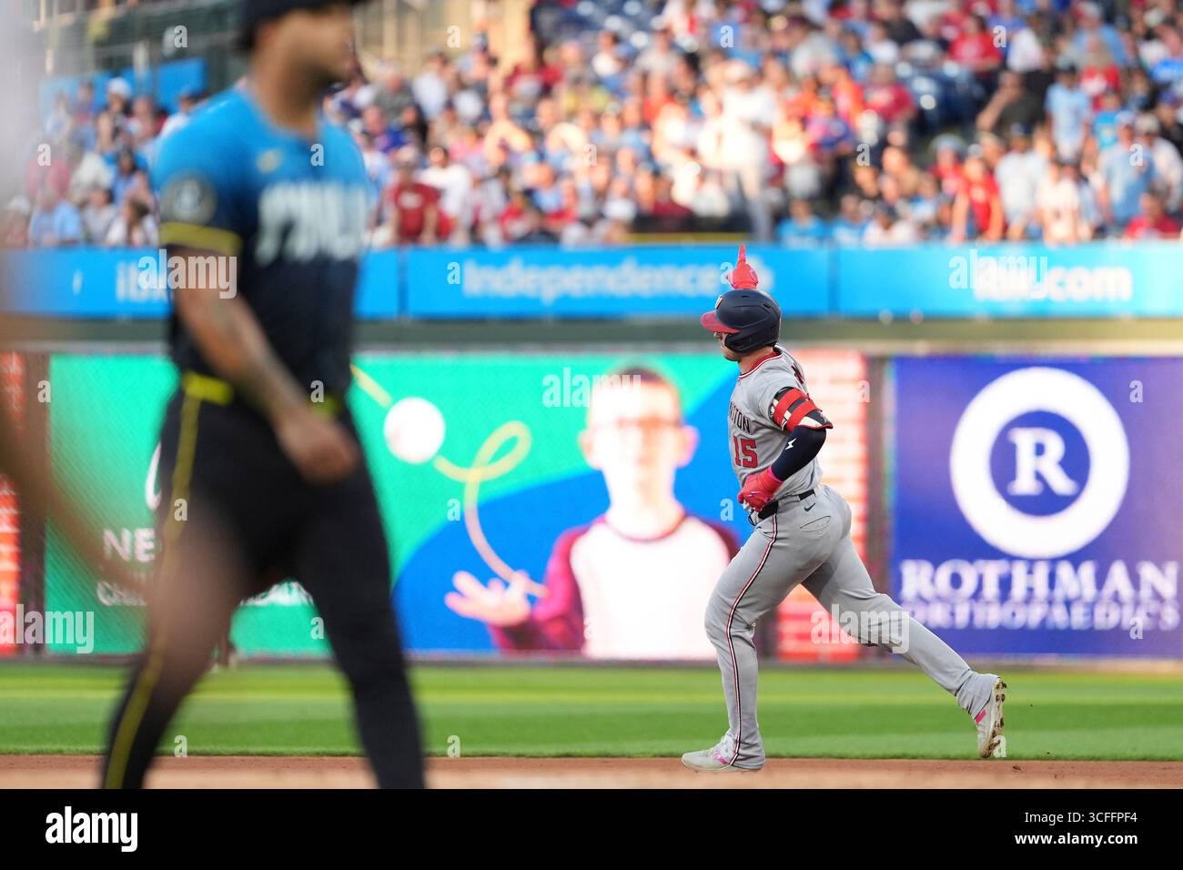 Washington Nationals' Riley Adams, right, reacts after hitting a three ...