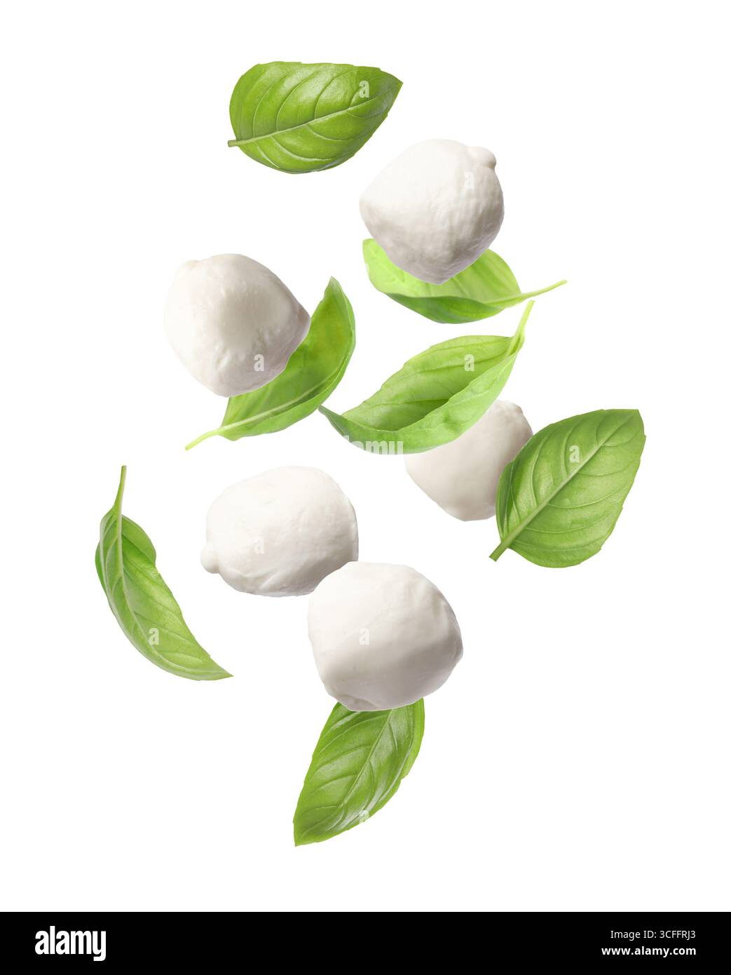 Mozzarella cheese balls with fresh basil leaves falling on white ...
