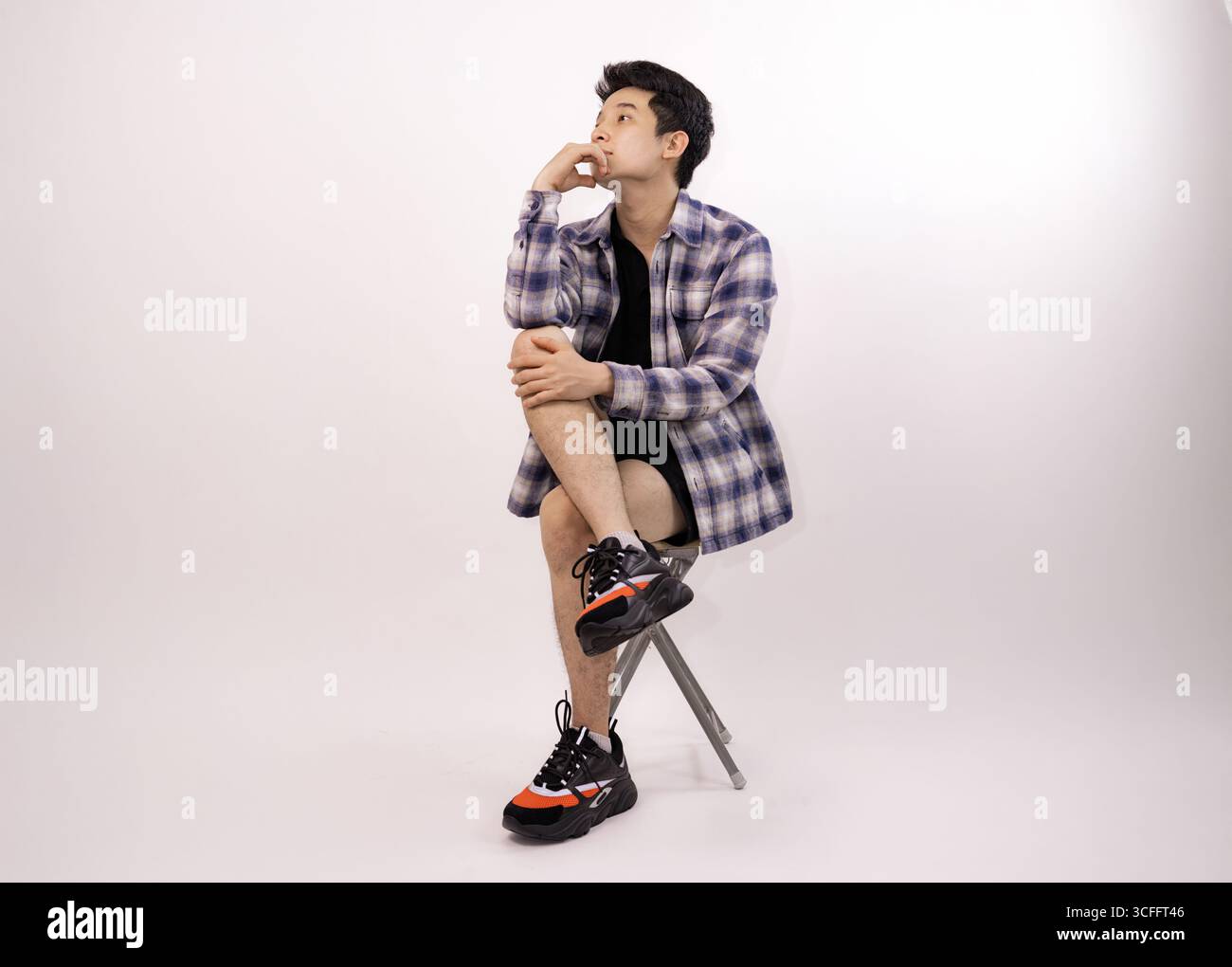 Thoughtful contemplative young individual in hi-res stock photography ...