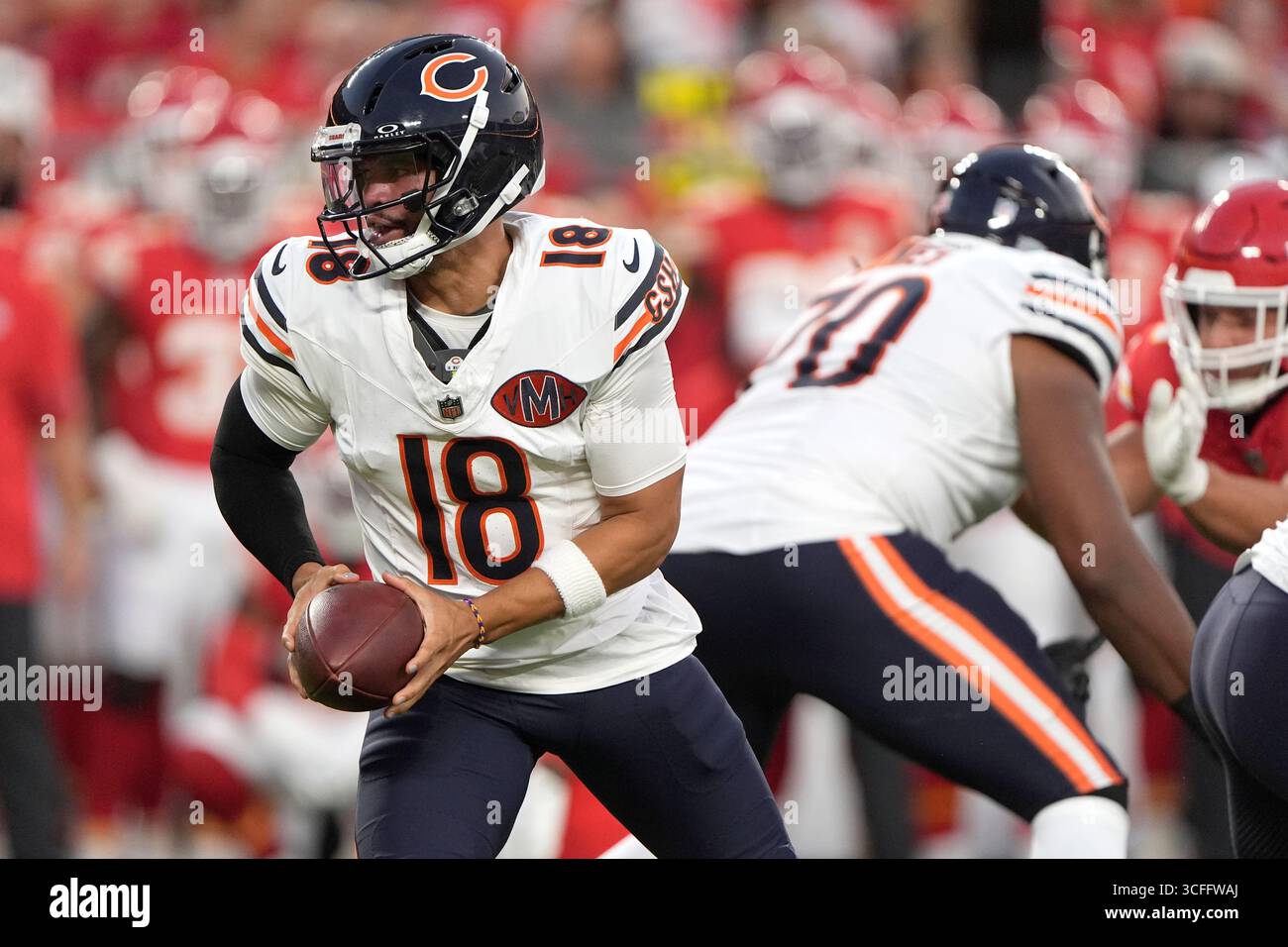 Chicago Bears quarterback Caleb Williams (18) looks to hand off during ...