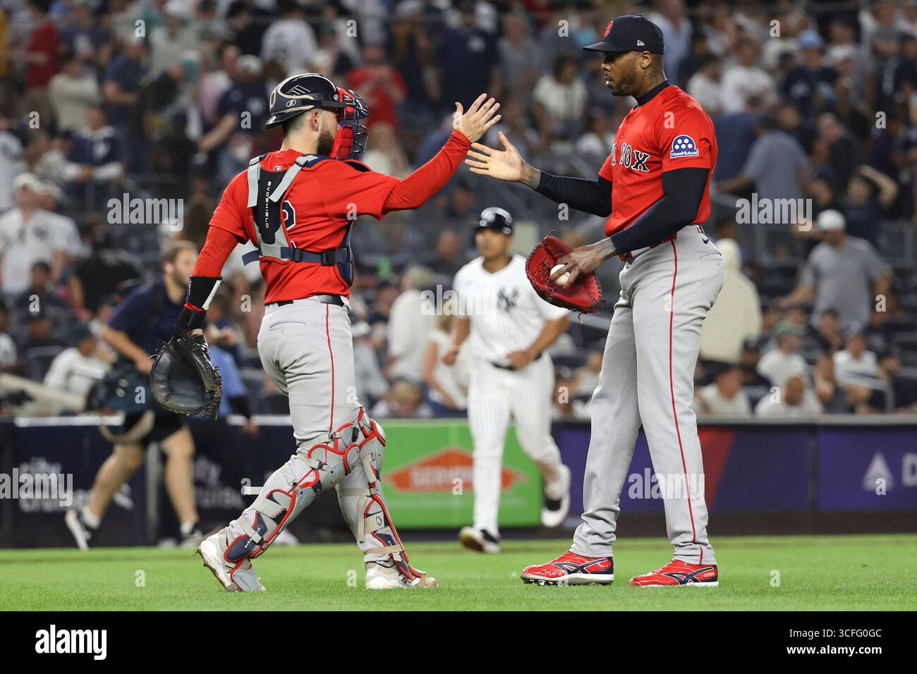 Boston Red Sox catcher Connor Wong, left, and pitcher Aroldis Chapman ...