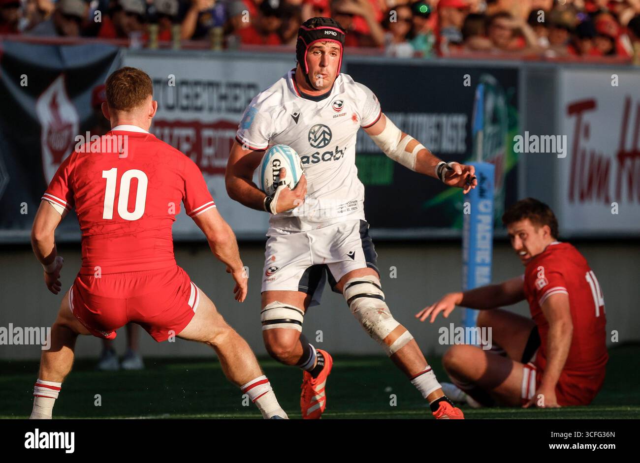 United States' Benjamin Bonasso, centre, looks to get past Canada's ...