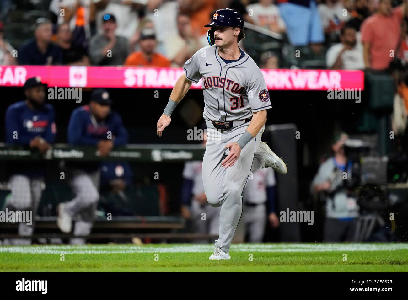 Houston Astros' Jacob Melton (31) advances toward home plate to score ...