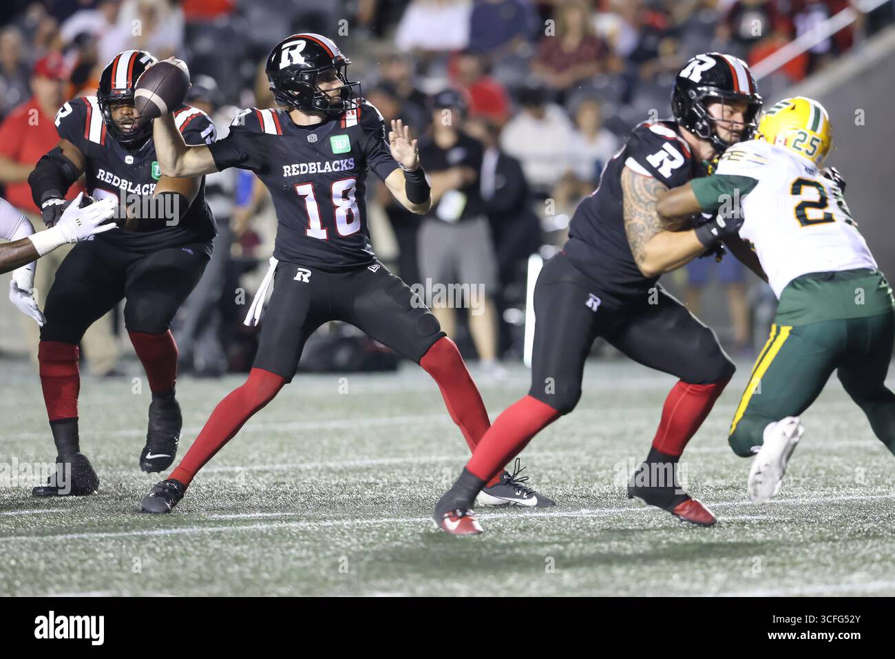 August 22, 2025: Ottawa Redblacks quarterback Dustin Crum (18) throws ...