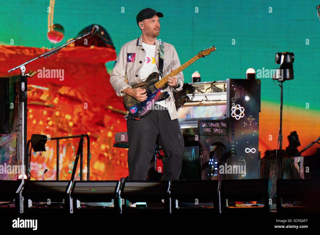 Jonny Buckland of Coldplay performs live on stage at Wembley Stadium ...