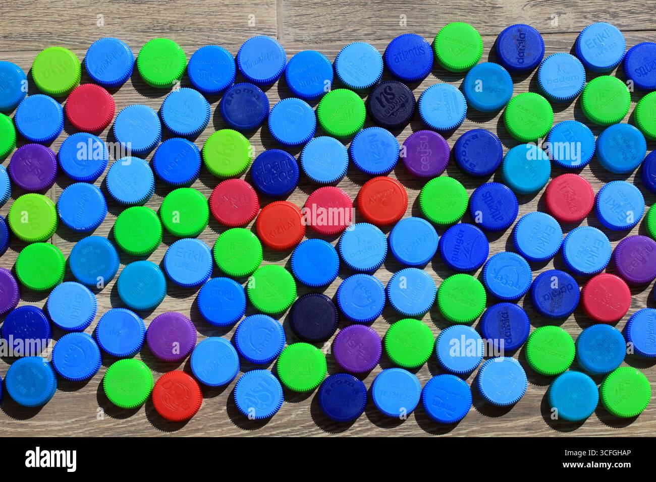 Different colored plastic water bottle caps. Colored plastic recycling ...