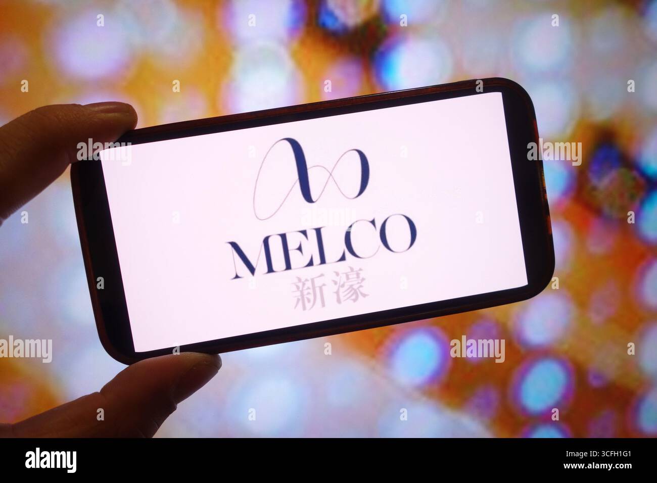 In this photo illustration, a Melco Resorts and Entertainment company ...