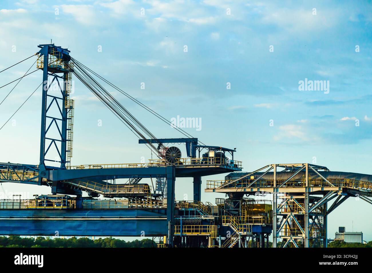 Large port line for unloading ships. Industrial port area. Conveyor ...