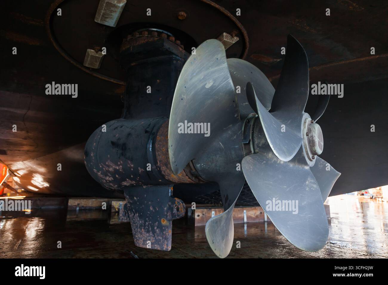 The bottom of a ship supported in dry dock with azimuth propulsion and ...