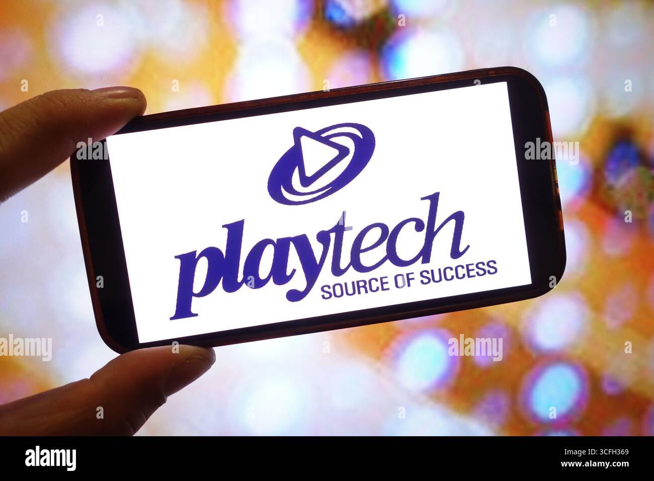 In this photo illustration, a Playtech company logo is seen displayed ...