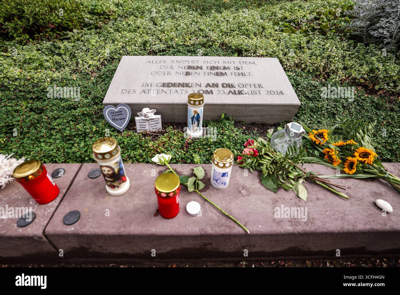 23 August 2025, North Rhine-Westphalia, Solingen: A memorial stone ...