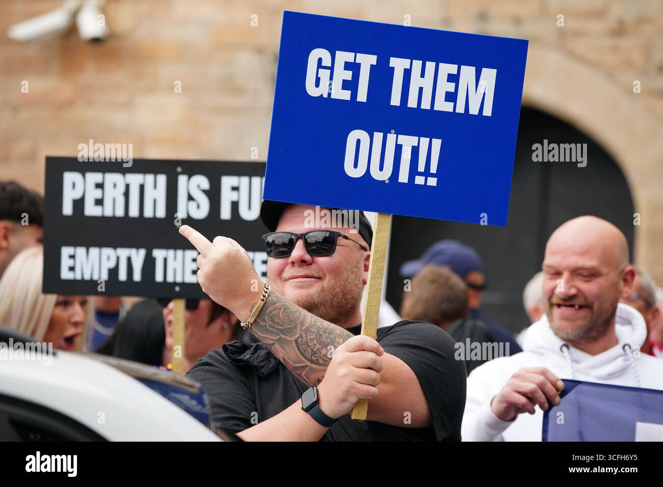 EDS NOTE HAND GESTURE People demonstrating at an Abolish Asylum System ...