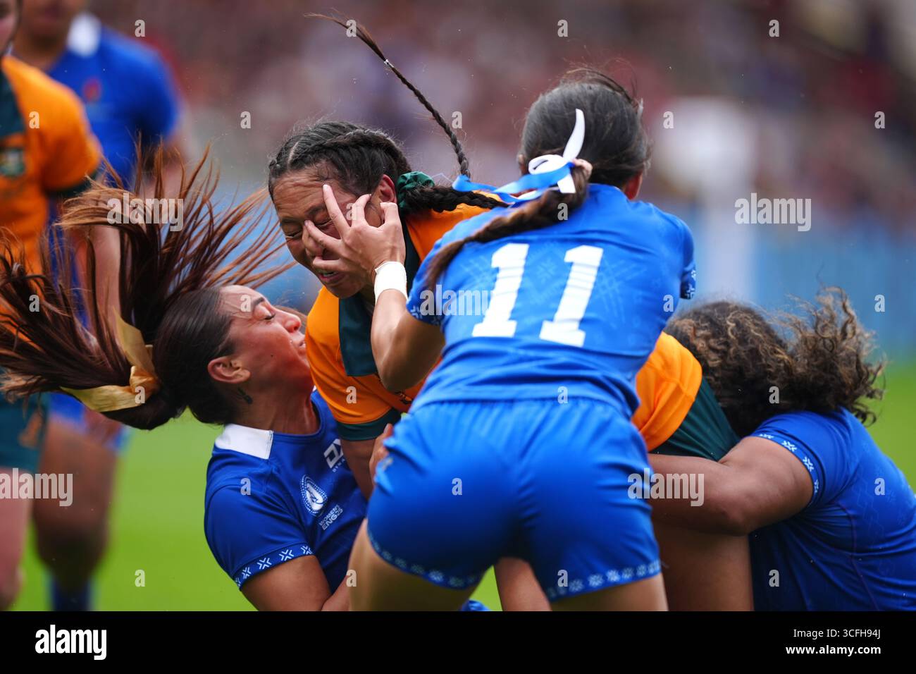 Australia's Cecilia Smith tackled by Samoa's Harmony Vatau, Drenna ...
