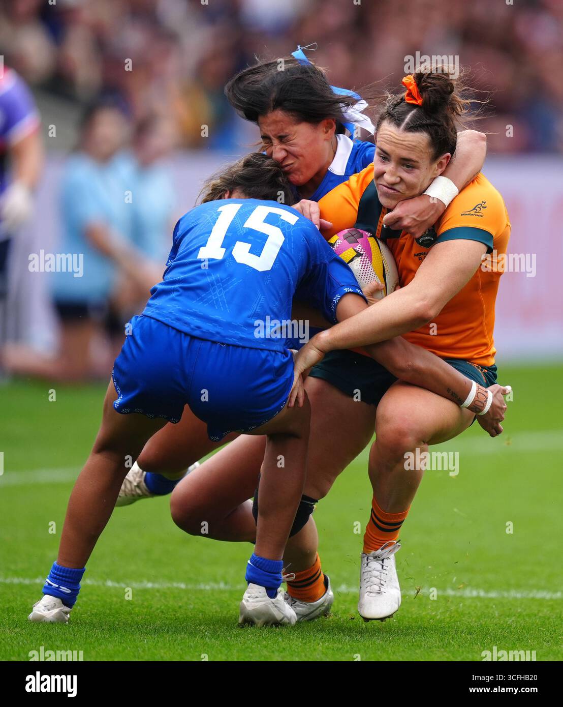 Australia's Maya Stewart (right) is tackled by Samoa's Drenna Falaniko ...