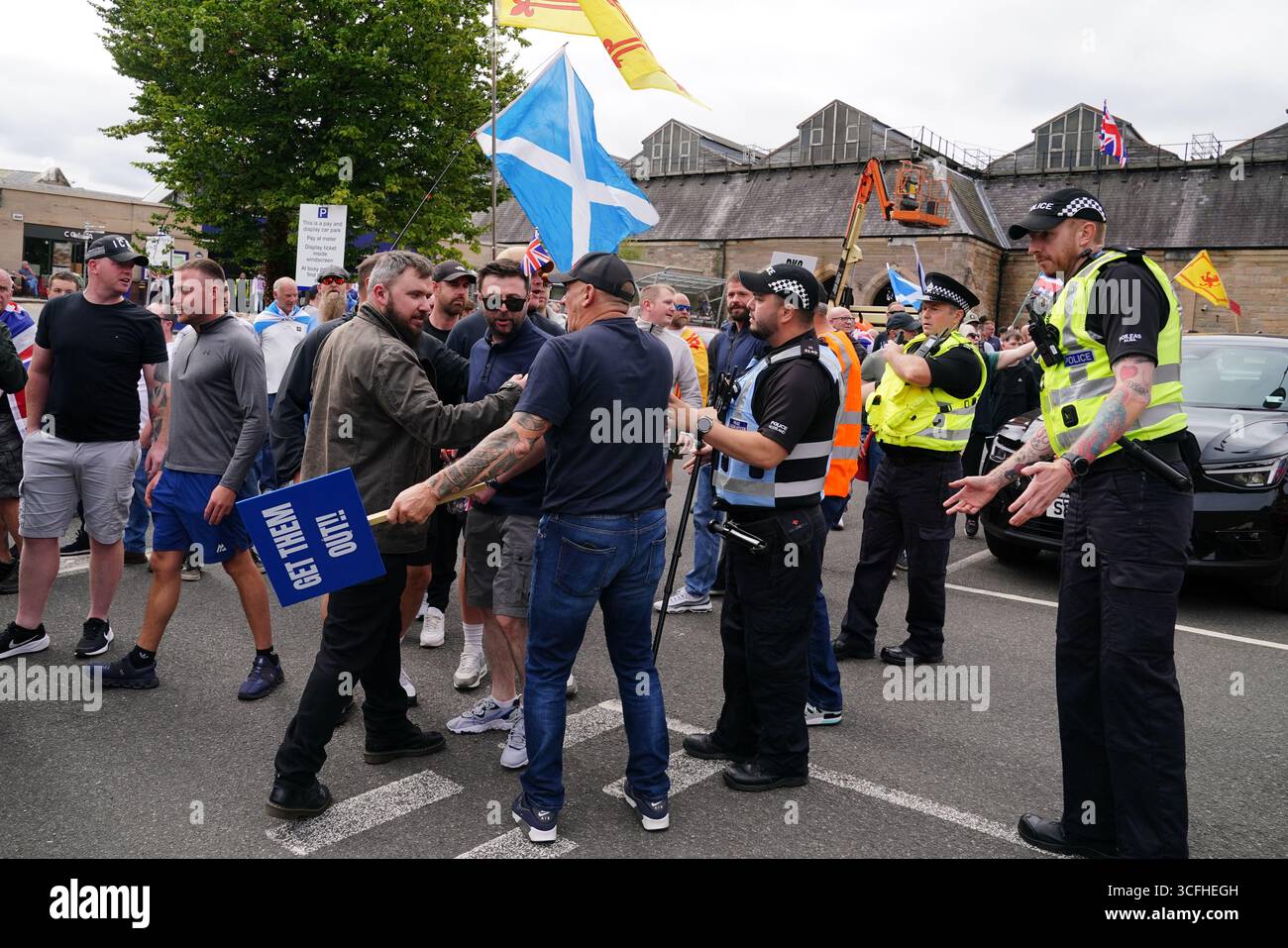 People demonstrating at an Abolish Asylum System protest outside the ...