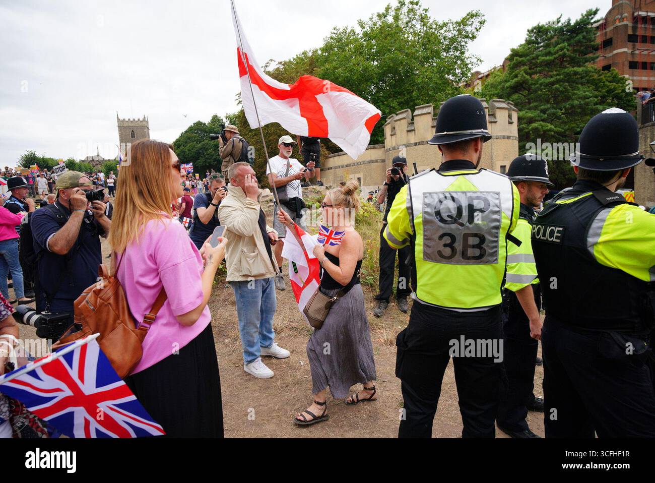 People demonstrating at an Abolish Asylum System protest at Castle Park ...