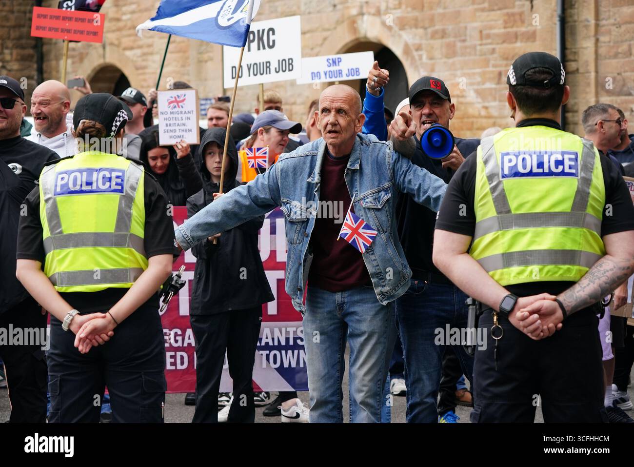 People demonstrating at an Abolish Asylum System protest outside the ...