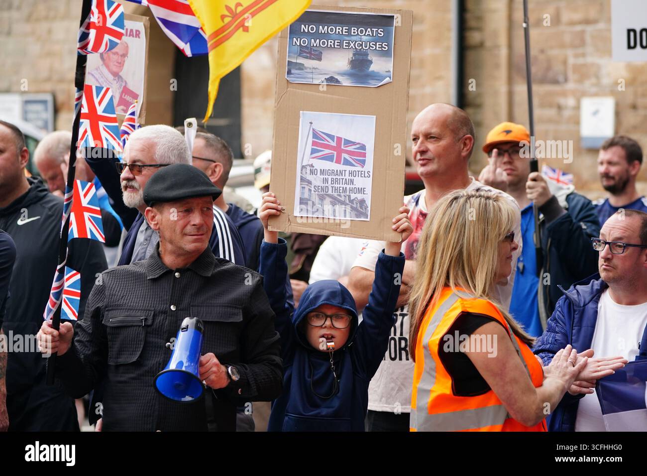 People demonstrating at an Abolish Asylum System protest outside the ...