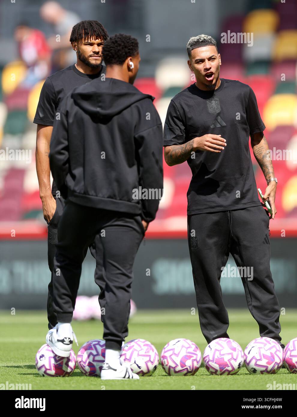 Aston Villa's Morgan Rogers (right) and Tyrone Mings (left) ahead of ...