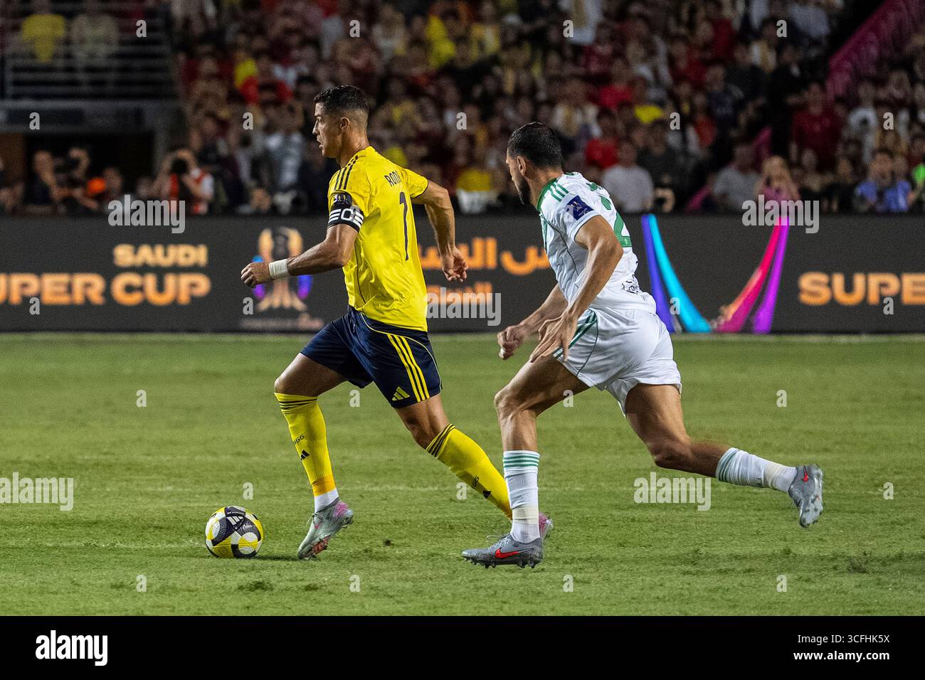 Al Nassr's Cristiano Ronaldo, left, plays the ball during the Saudi ...