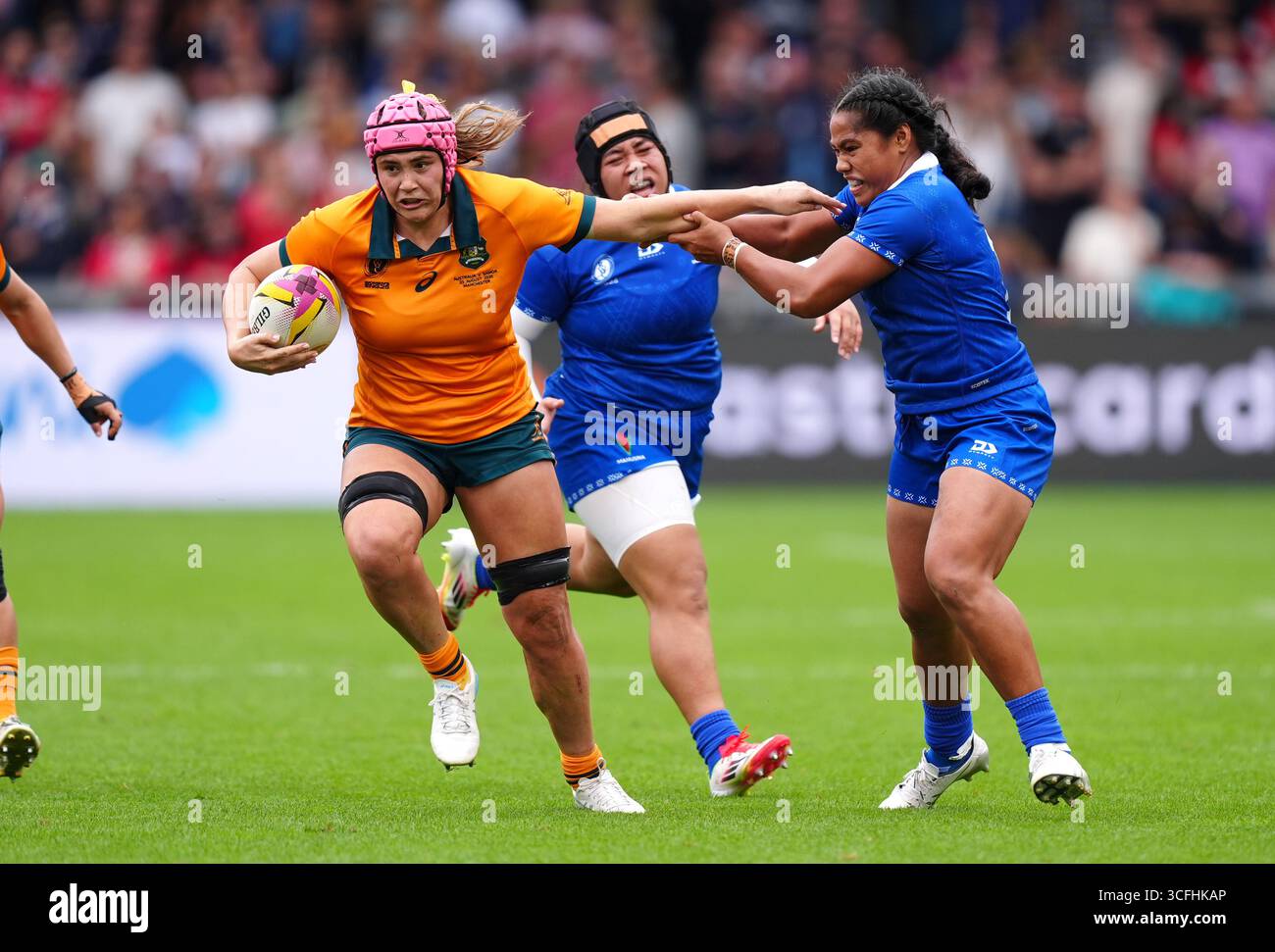 Australia's Piper Duck is tackled by Samoa's Lulu Leuta and Lutia Col ...