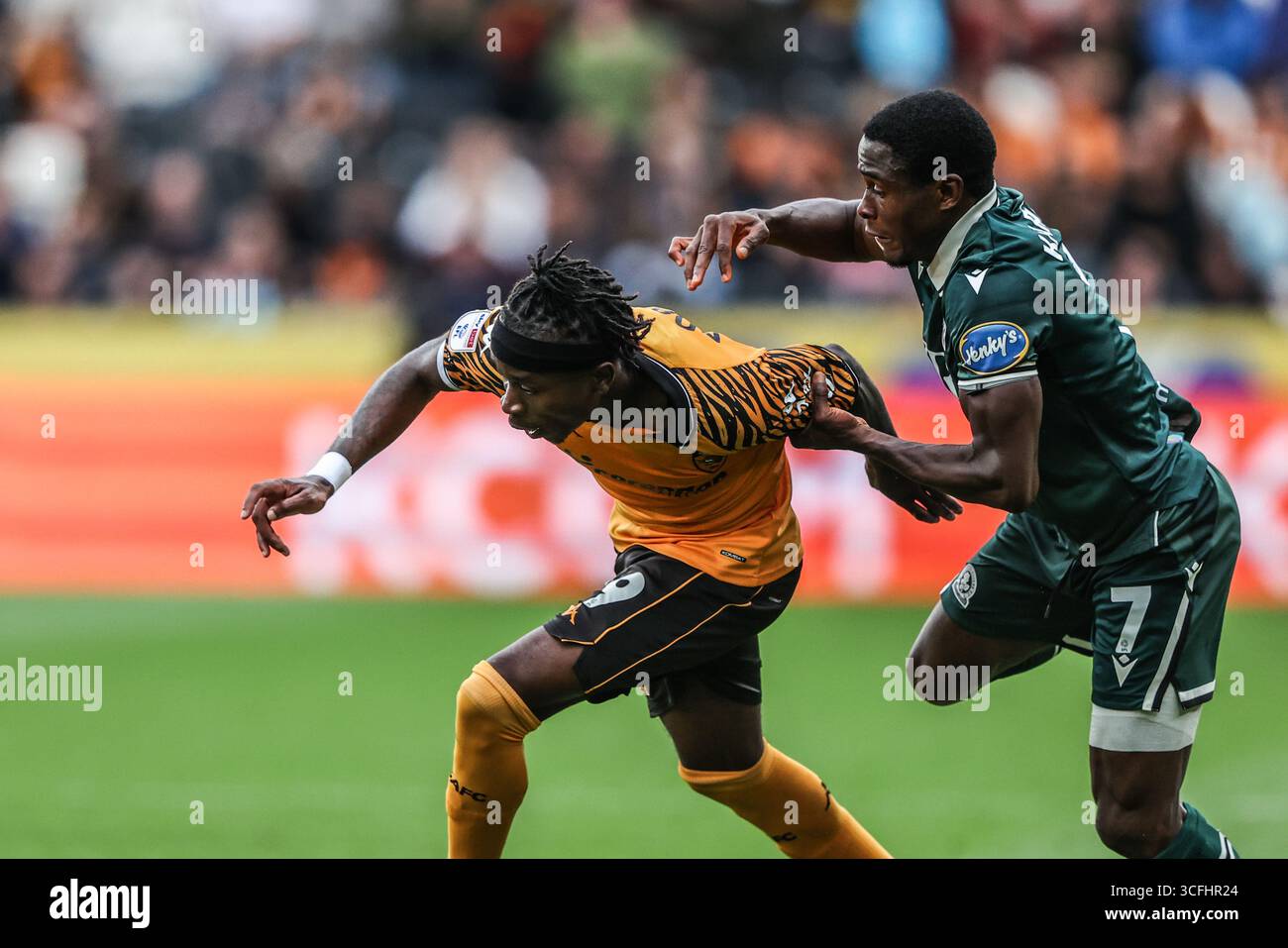 Joel Ndala of Hull City is fouled by Augustus Kargbo of Blackburn ...
