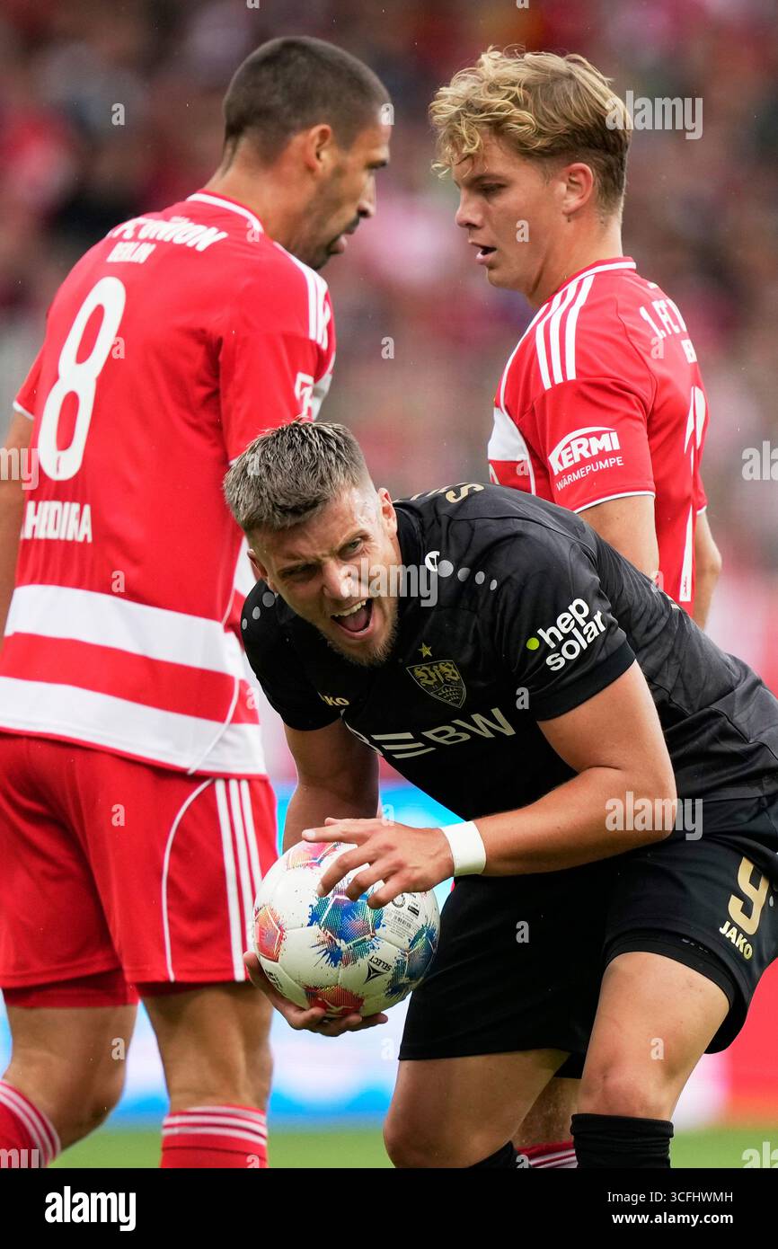 Stuttgart's Ermedin Demirovic, front, catches the ball during the ...