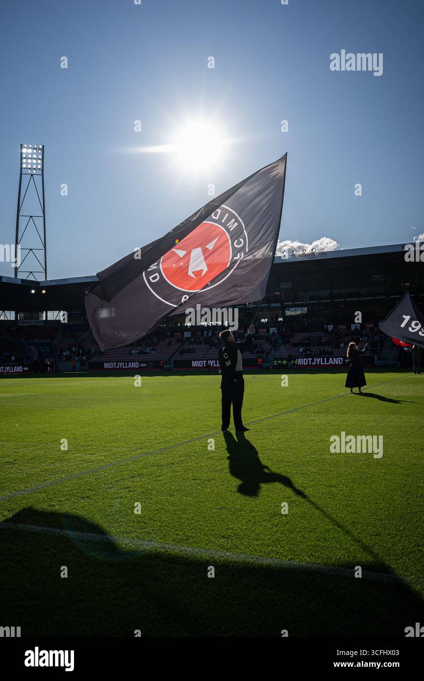 Herning, Denmark. 21st, August 2025. A mascot is waving a giant FC ...