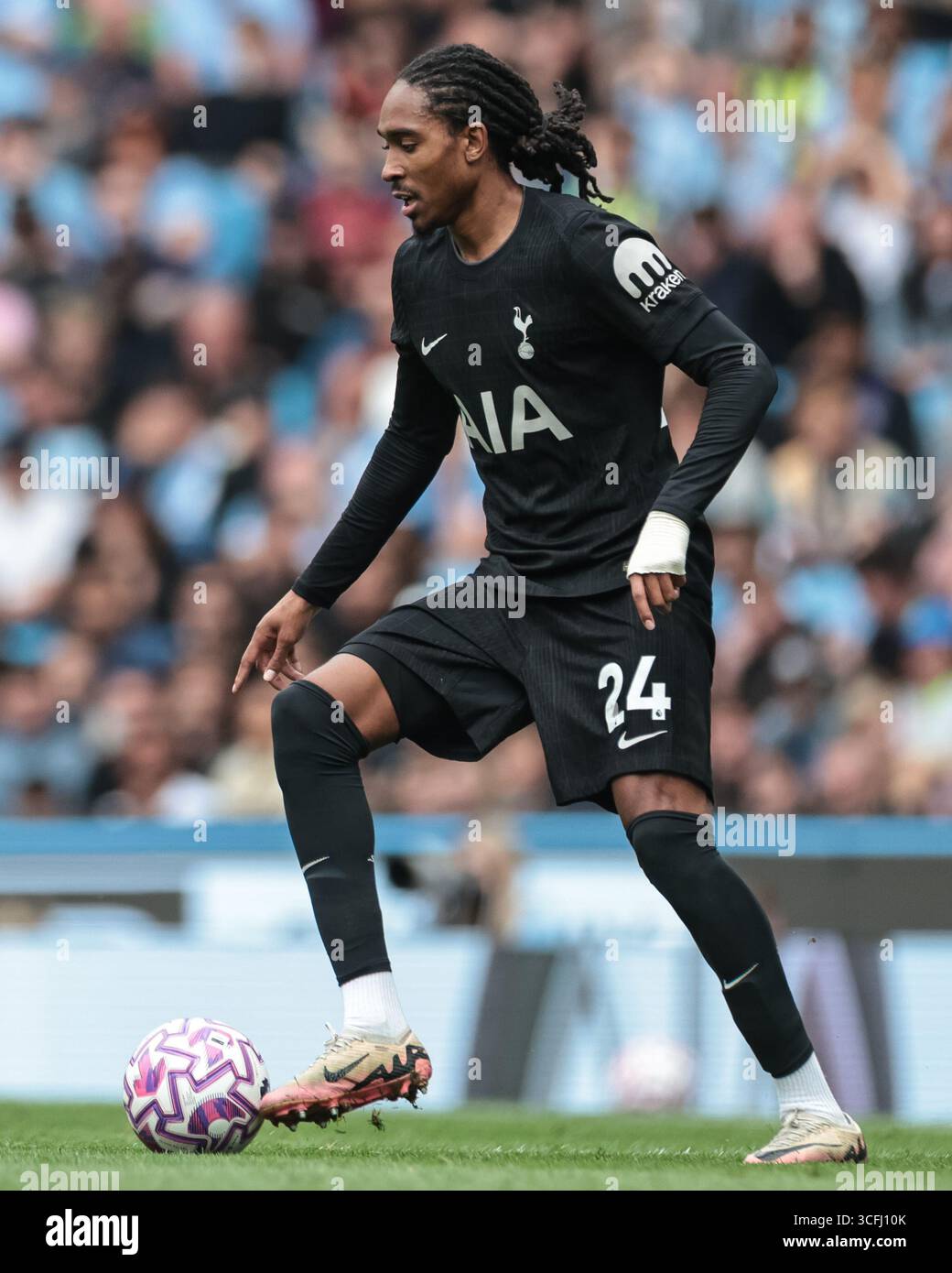 Djed Spence of Tottenham Hotspur with the ball during the Premier ...