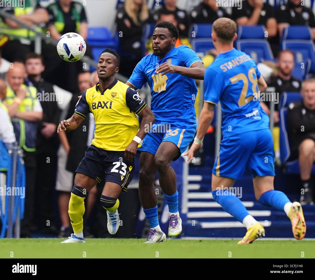 Oxford United's Siriki Dembele battles for the ball with Birmingham ...