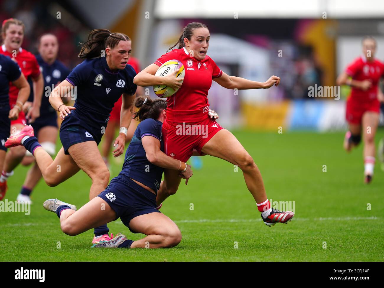 Wales' Nel Metcalfe is tackled by Scotland's Francesca McGhie during ...