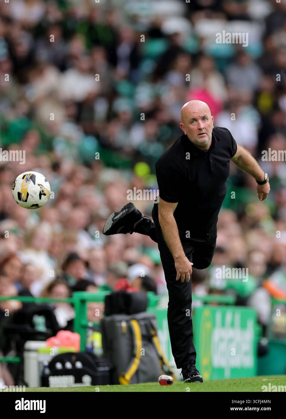 Livingston manager David Martindale attempts to kick the ball during ...
