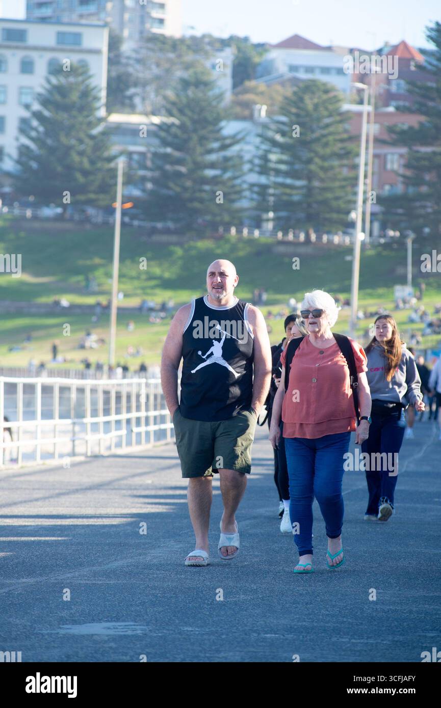 Sydney, Australia. 23rd, August, 2025. Aussies walking along the Bondi ...