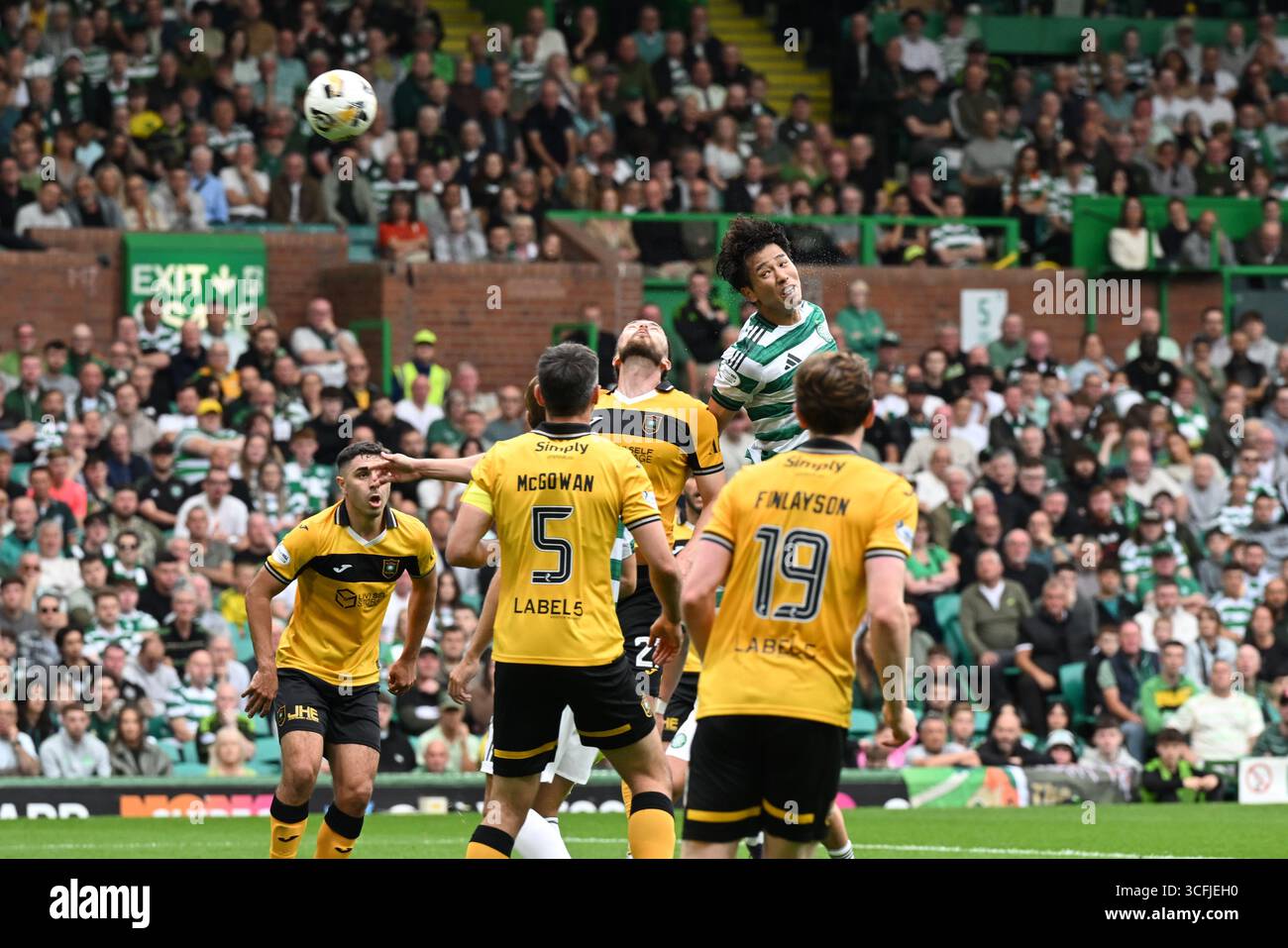GLASGOW, SCOTLAND - AUGUST 23: Celtic’s Shin Yamada misses a header ...
