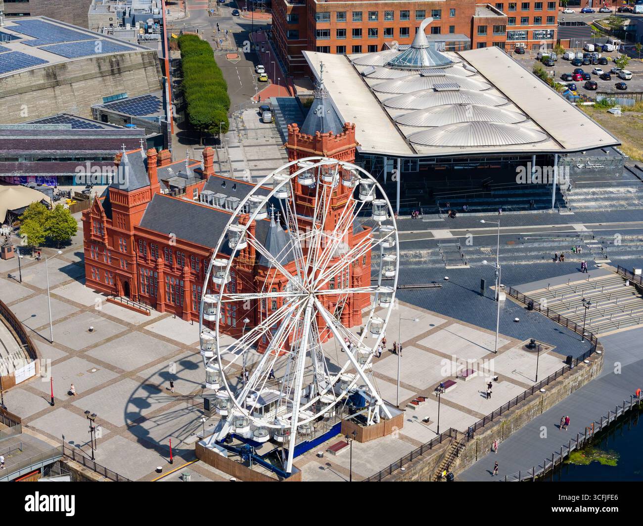 Aerial drone view of Cardiff Bay with Ferris wheel, Pierhead and Senedd ...