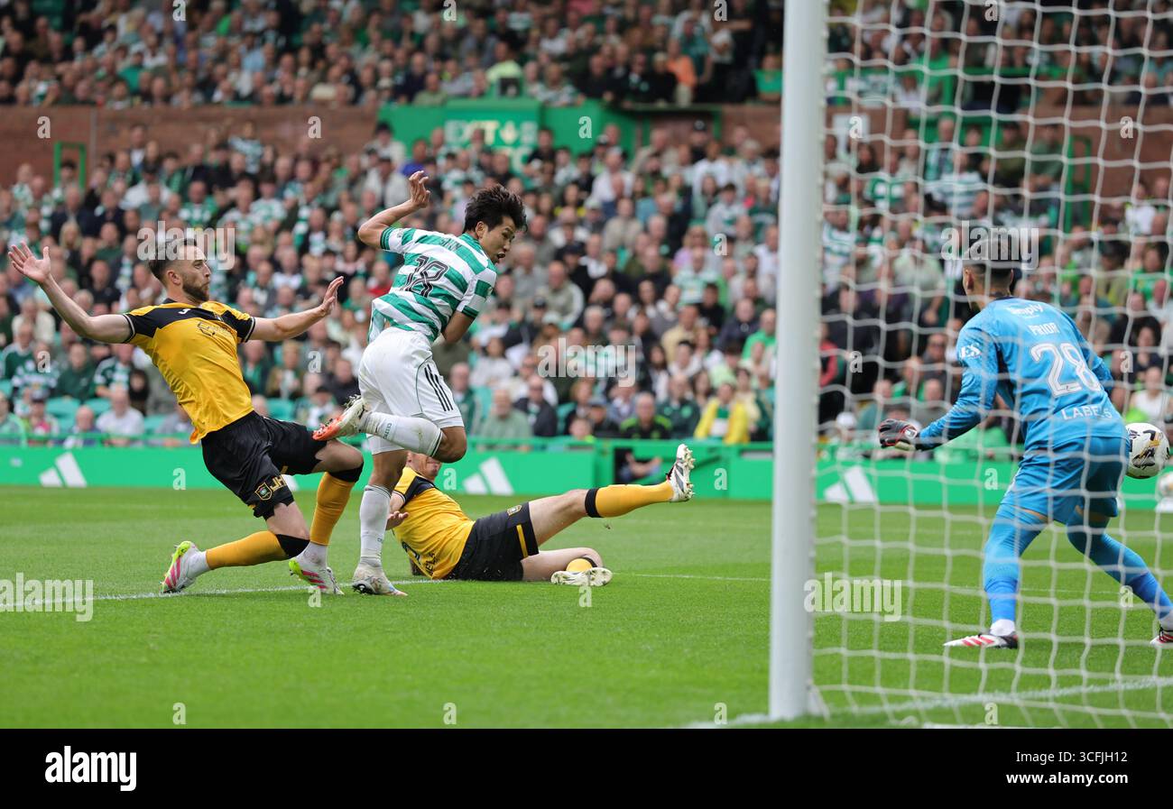Celtic's Shin Yamada (second left) has a shot on goal during the ...
