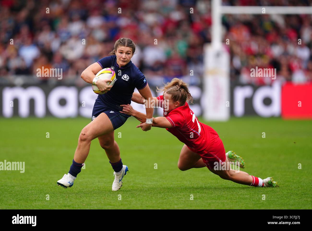 Scotland's Helen Nelson (left) is tackled by Wales' Carys Cox during ...
