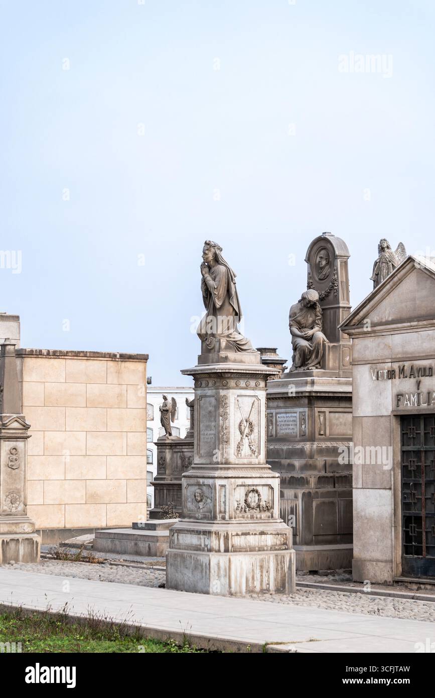 Praying female funerary statue in classical style atop marble pedestal ...