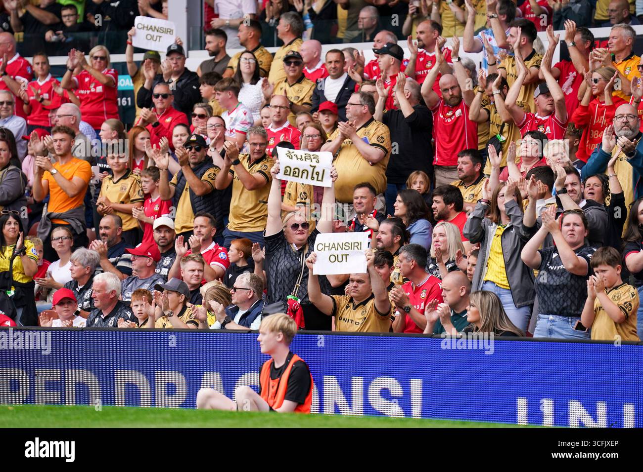Wrexham fans with Chansiri Out posters during the Wrexham AFC v ...