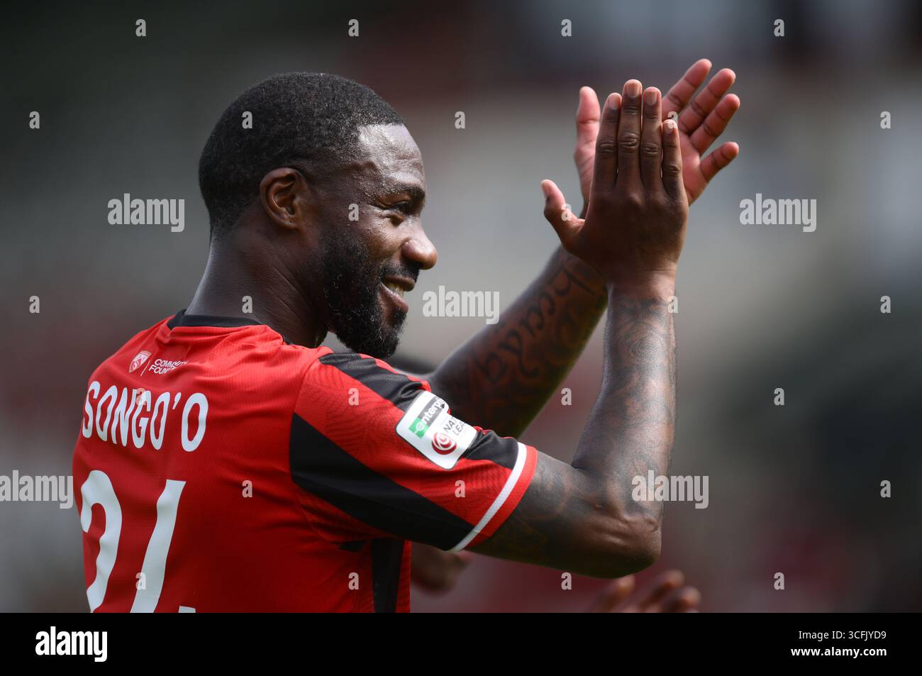 Morecambe's Yann Song'o applauds the fans after the Enterprise National ...