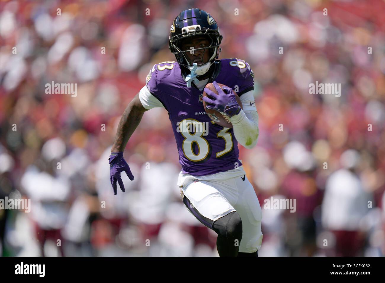 Baltimore Ravens wide receiver LaJohntay Wester (83) runs with the ball ...