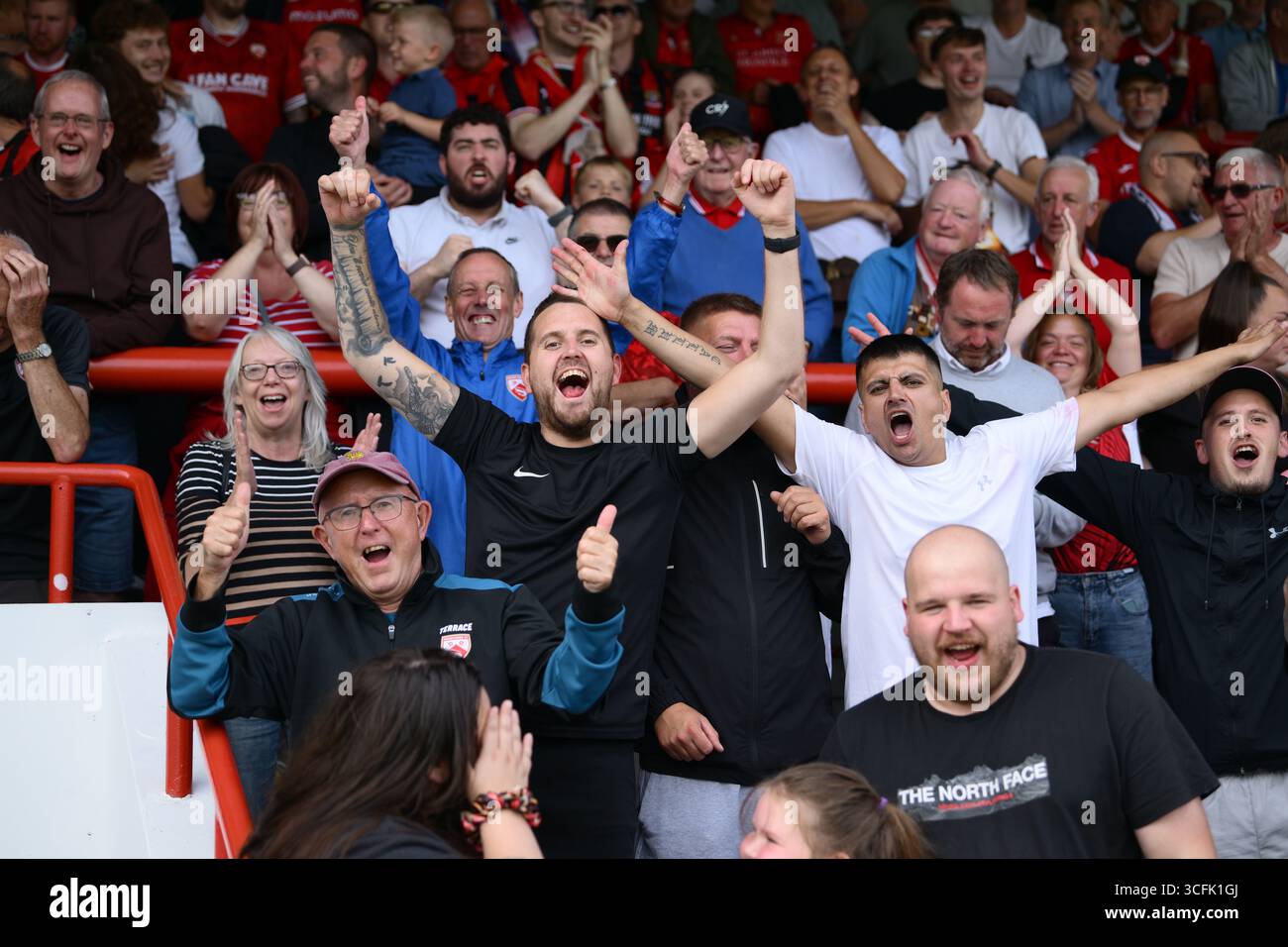 Morecambe fans celebrate in the stands during the Enterprise National ...