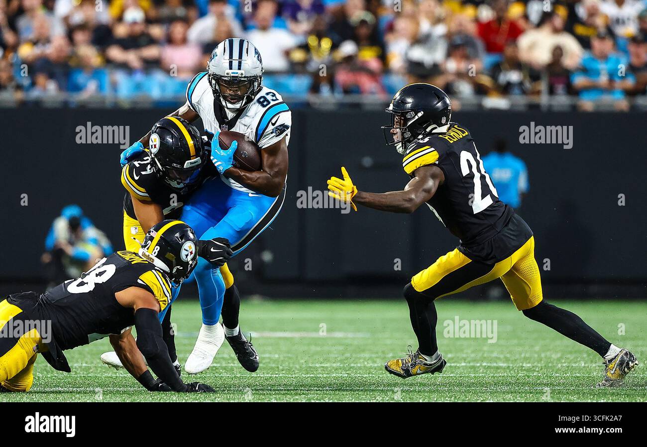 August 21, 2025: Panthers wide receiver David Moore (83) gets tackled ...