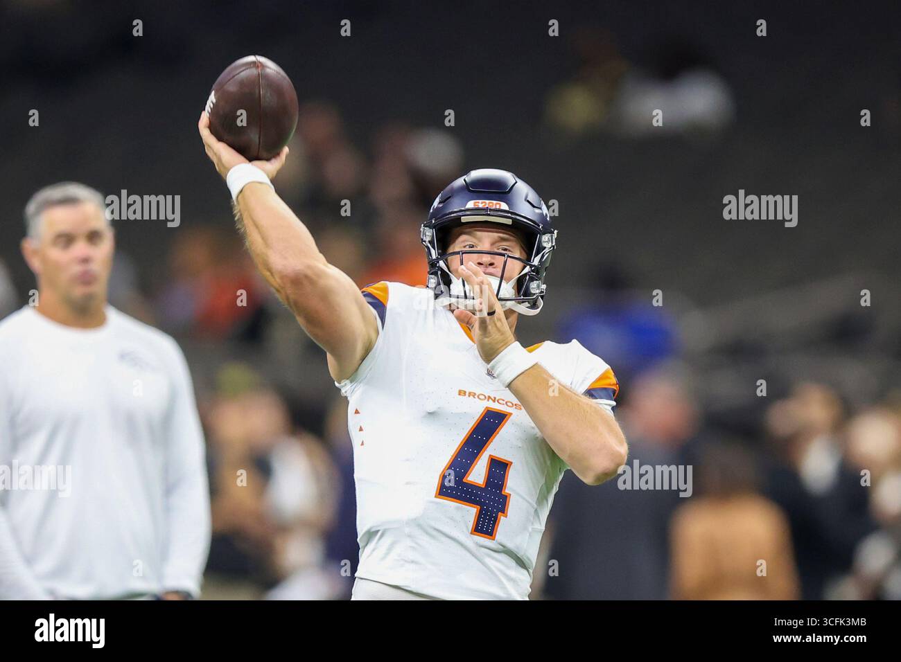 Denver Broncos quarterback Sam Ehlinger (4) attempts a pass during a ...
