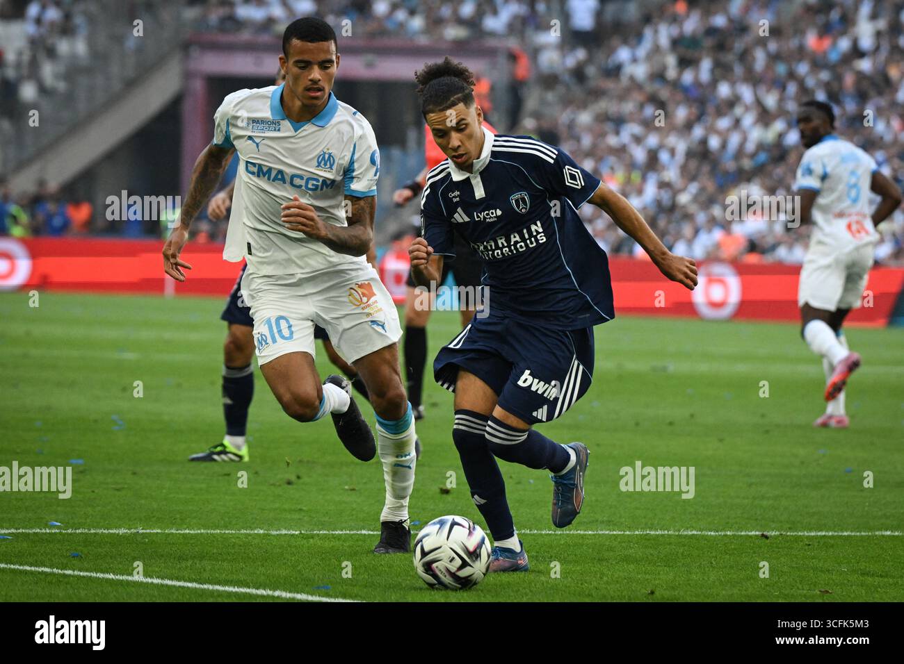 Paris FC midfielder Ilan Kebbal fights for the ball during the French ...